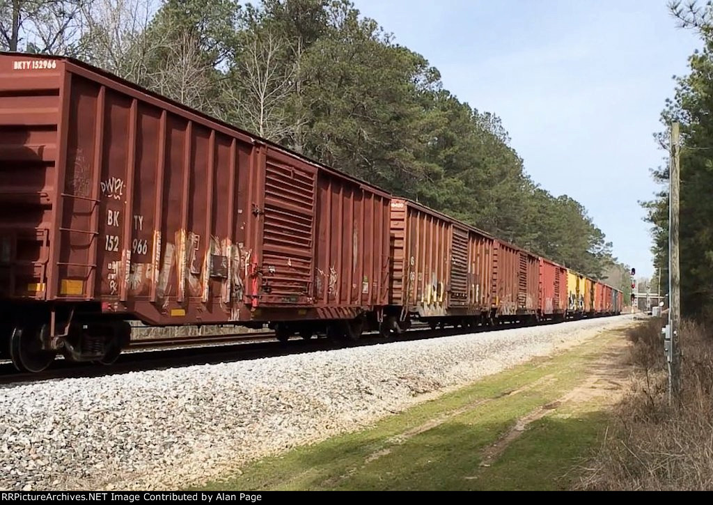 BKTY 152966 and a line of boxcars roll SB